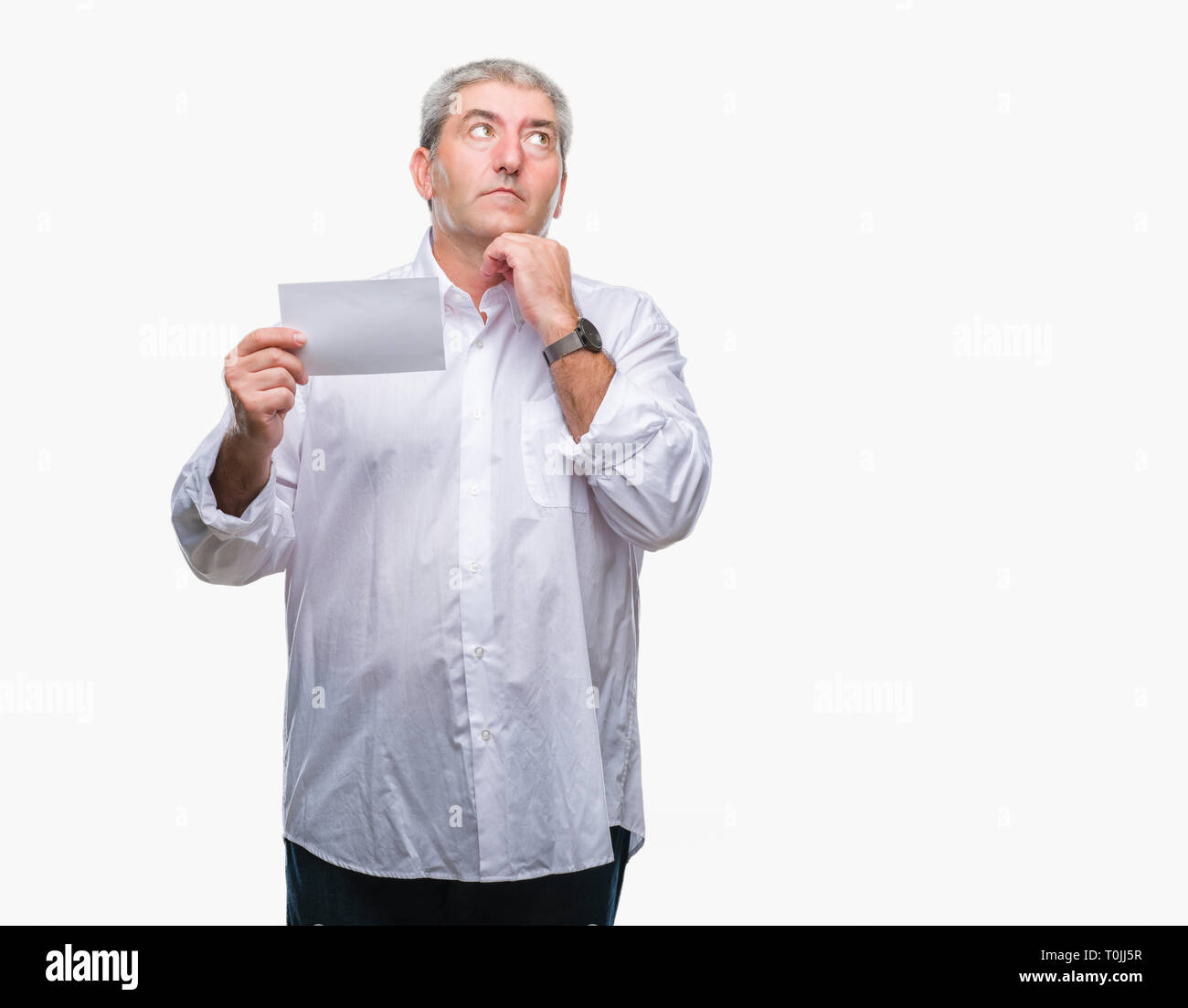 Handsome senior man holding blank card over isolated background serious ...