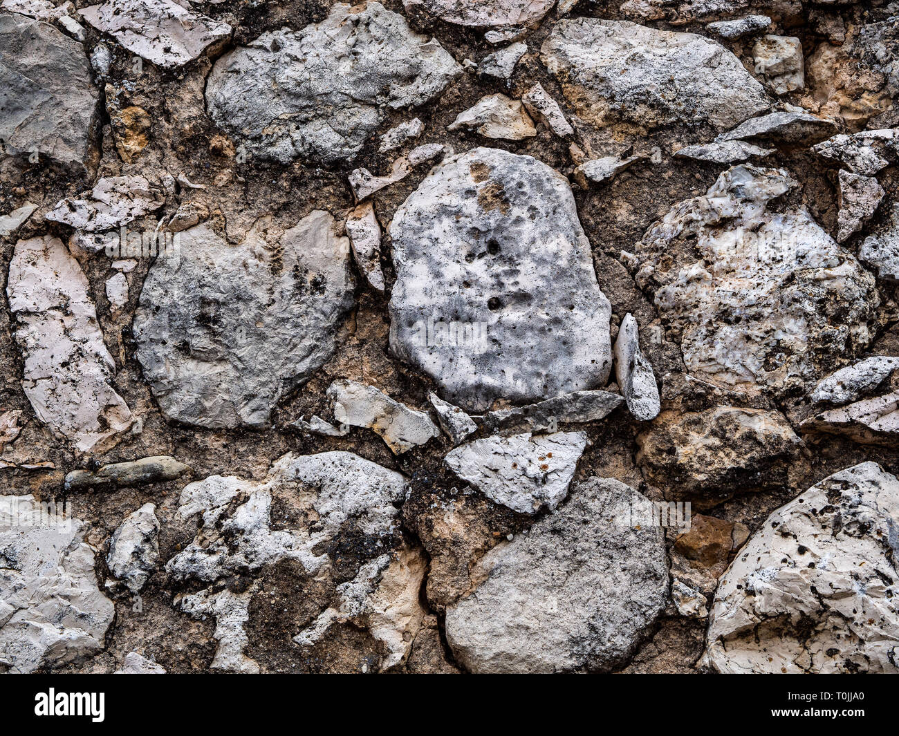 Photograph taken of the ground and evidencing stone rocks to get ...