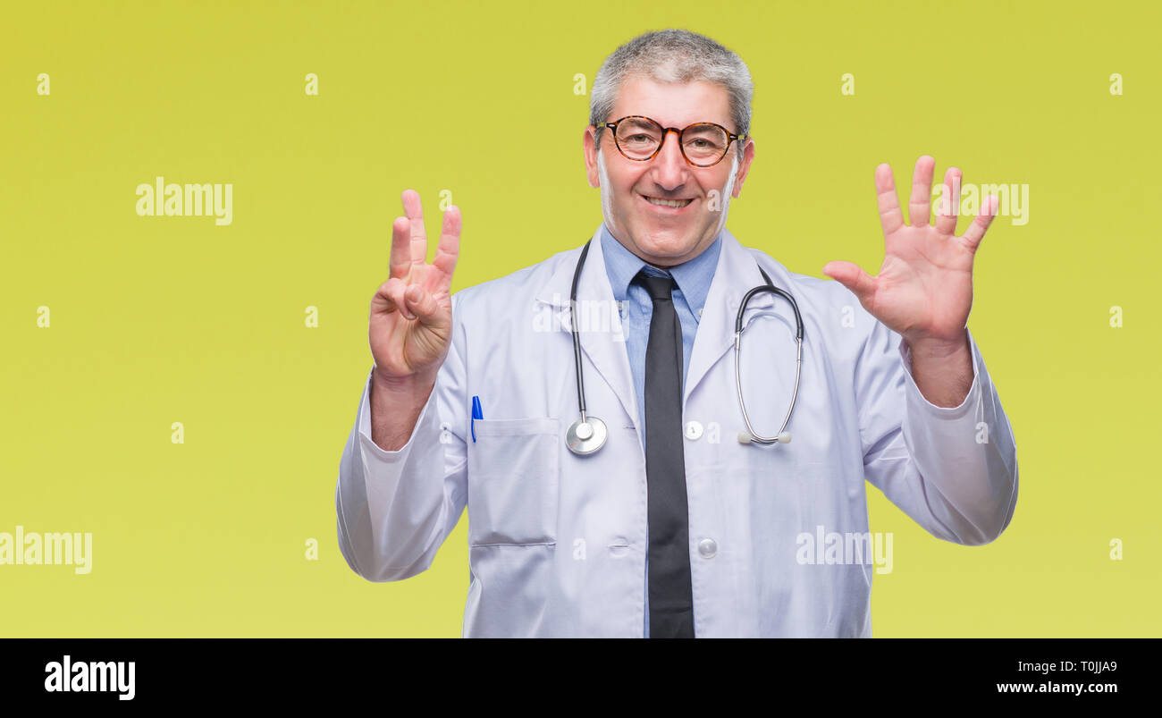 Handsome senior doctor man over isolated background showing and ...