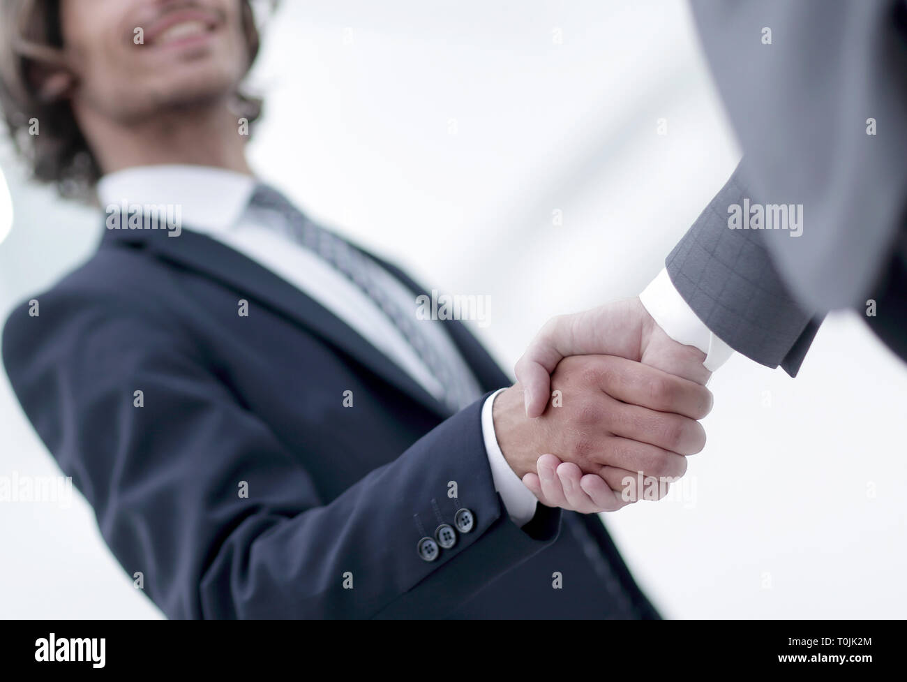 Handshake between two men in hi-res stock photography and images - Alamy
