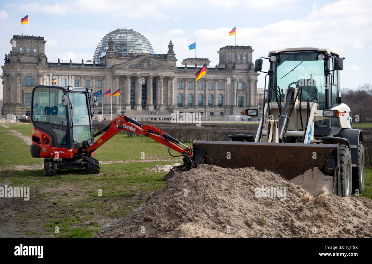 Berlin, Germany. 20th Mar, 2019. Two excavators are standing on the ...