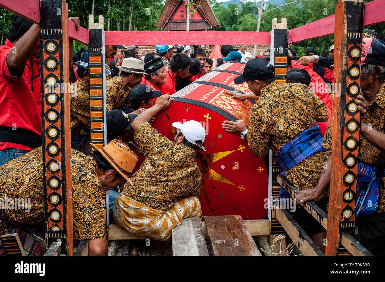 Residents are seen lifting their relatives' coffins during the Rambu ...