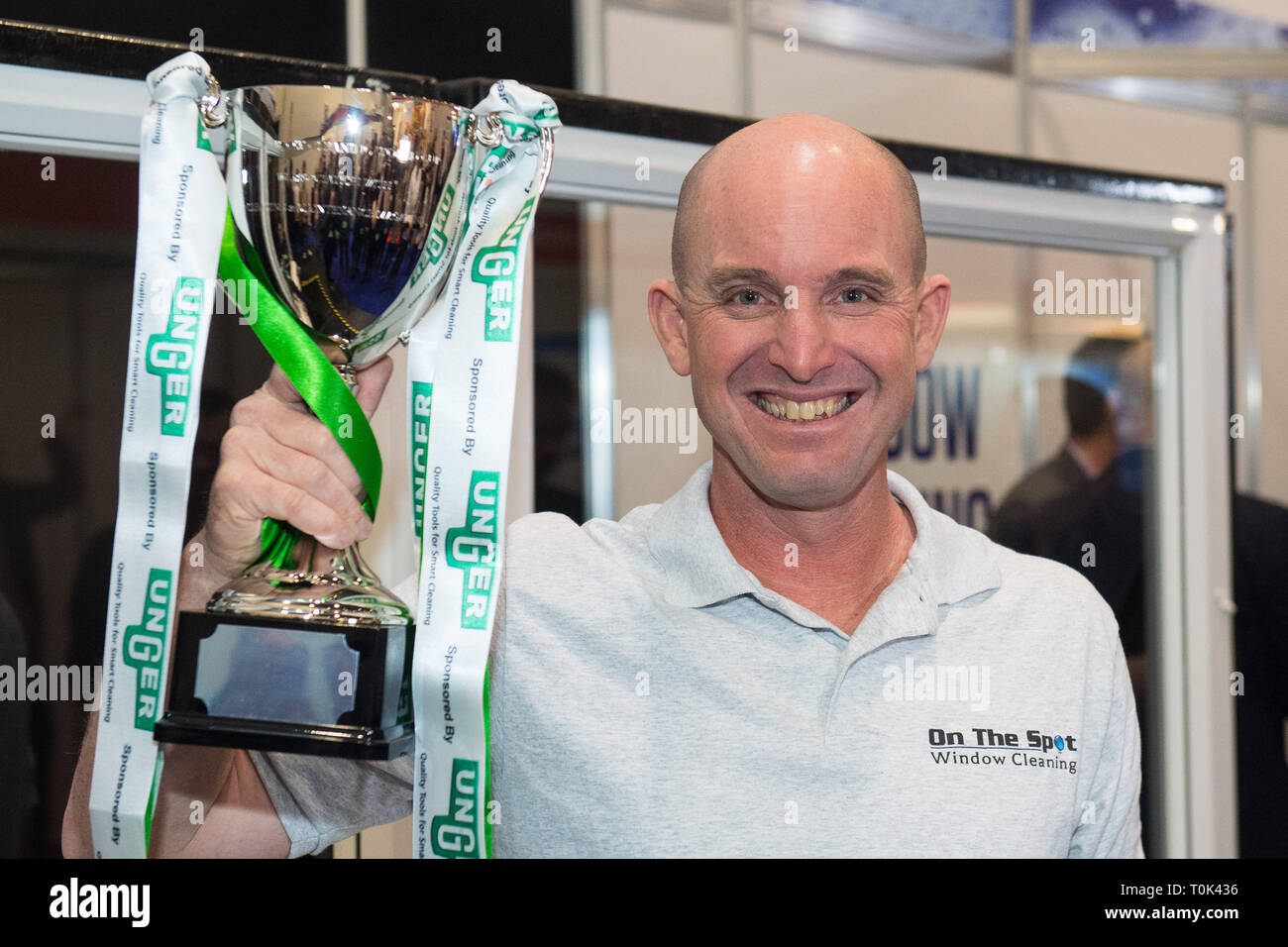 California's Jeremiah Hickey holds the trophy after winning the first ...