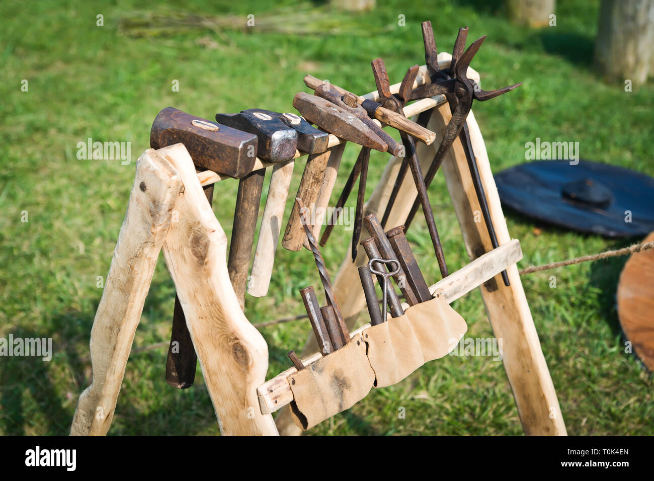 Old wooden rack with blacksmith's tool Stock Photo - Alamy
