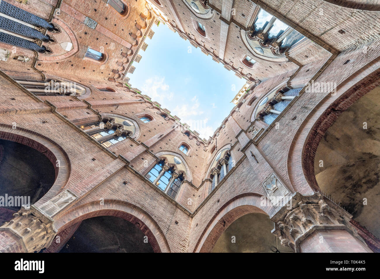 Ancient medieval buildings of Tuscany, upward view from the ground ...