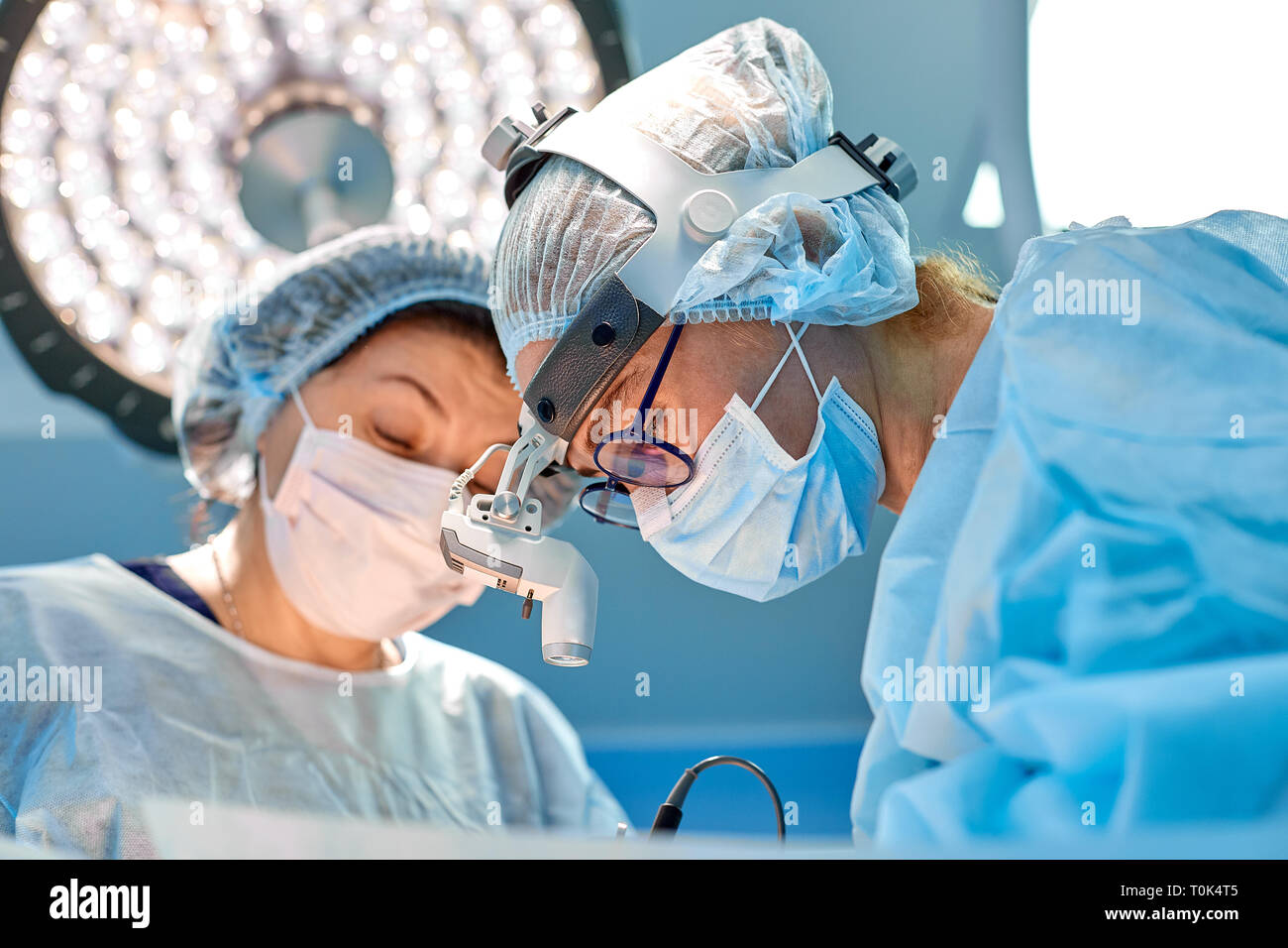 surgery, medicine and people concept - group of surgeons at operation ...