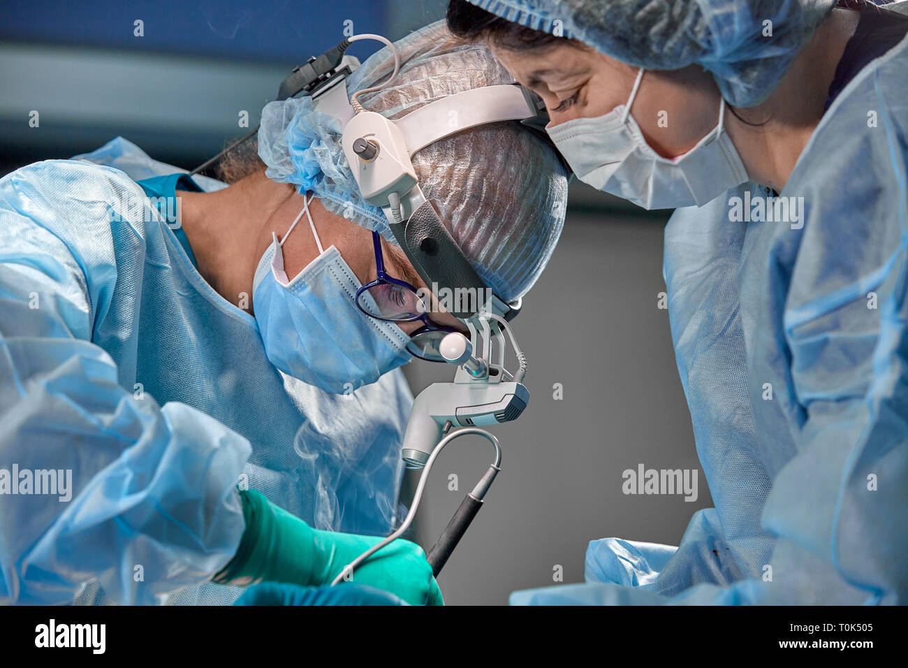 surgery, medicine and people concept - group of surgeons at operation ...