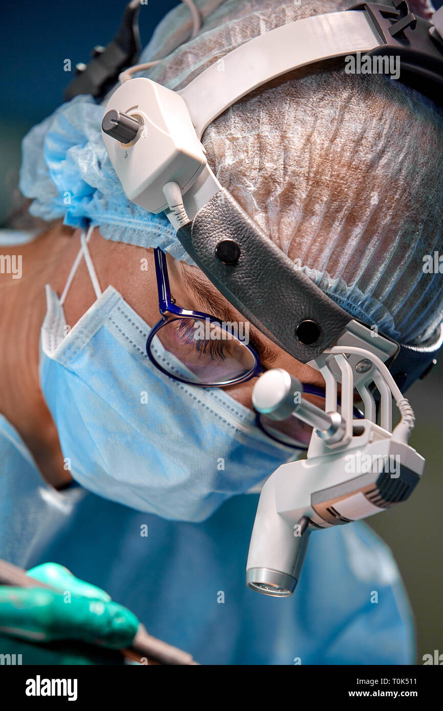 Close up portrait of female surgeon doctor wearing protective mask and ...