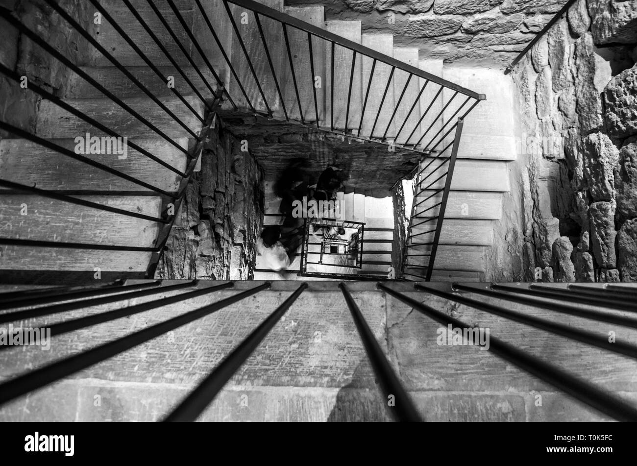 top view from the inside of the historic tower with ghosts coming down ...