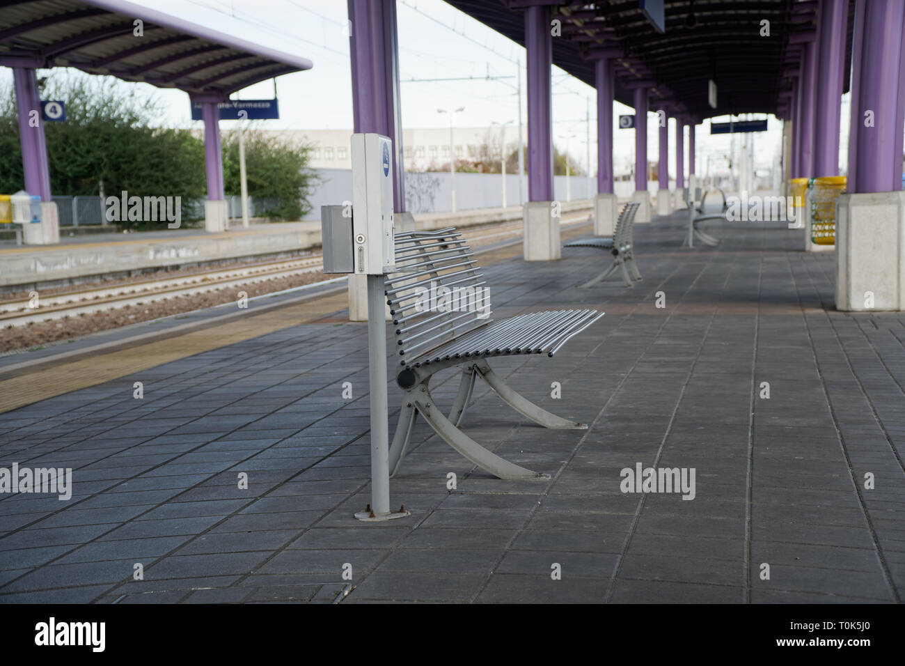 Empty train station bench in hi-res stock photography and images - Alamy