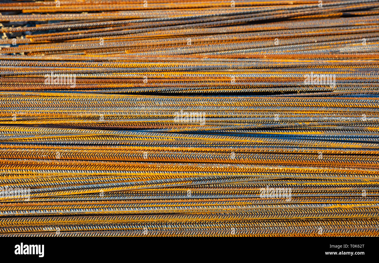 Steel bars texture background. Rusty metal reinforcement rods pile at a ...
