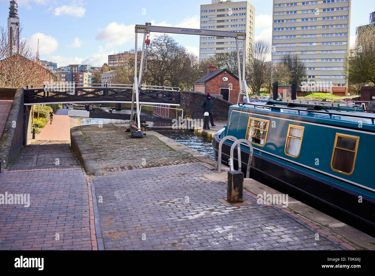 Narrowboat entering lock number one at Cambrian Wharf on a cold winter ...
