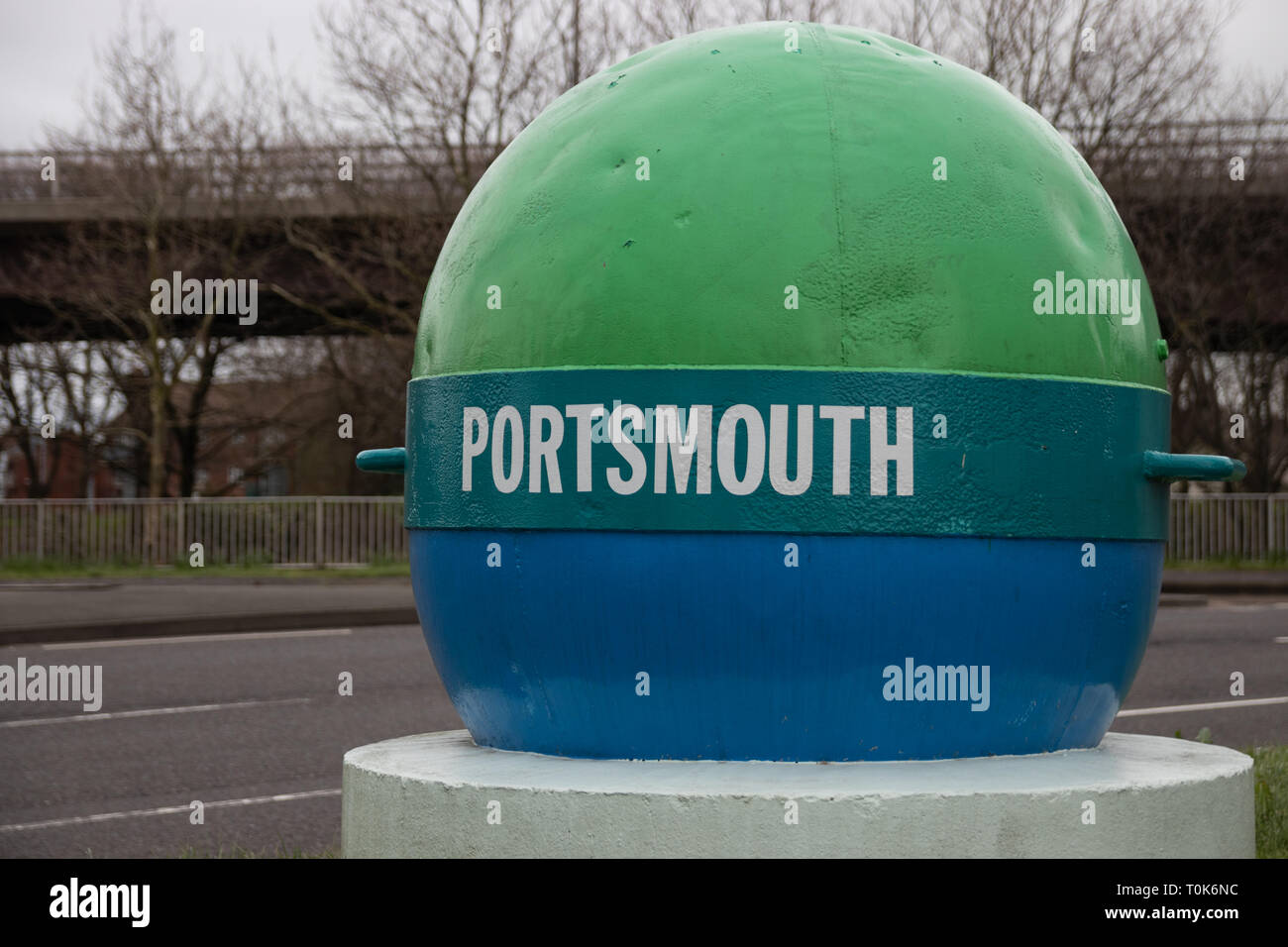 Portsmouth sign written on a buoy at the exit of Portsmouth ferry port ...