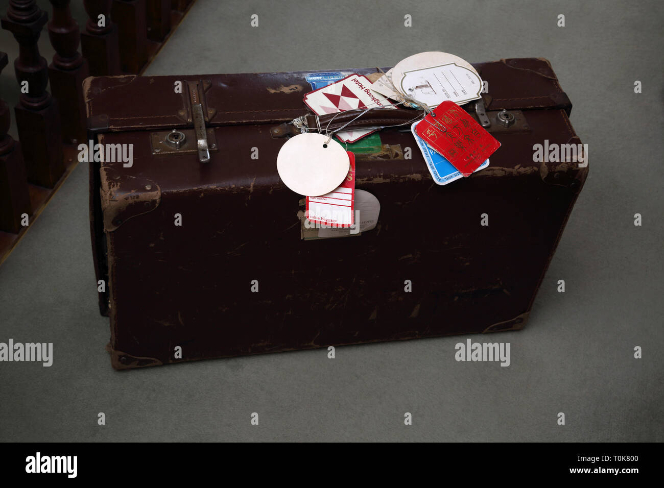 Vintage Suitcase with old Travel Labels Stock Photo - Alamy