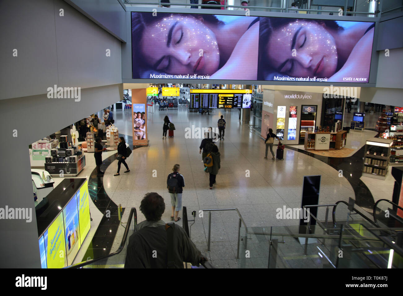 England Heathrow Airport Terminal Two Passenger on Escalator by Duty ...