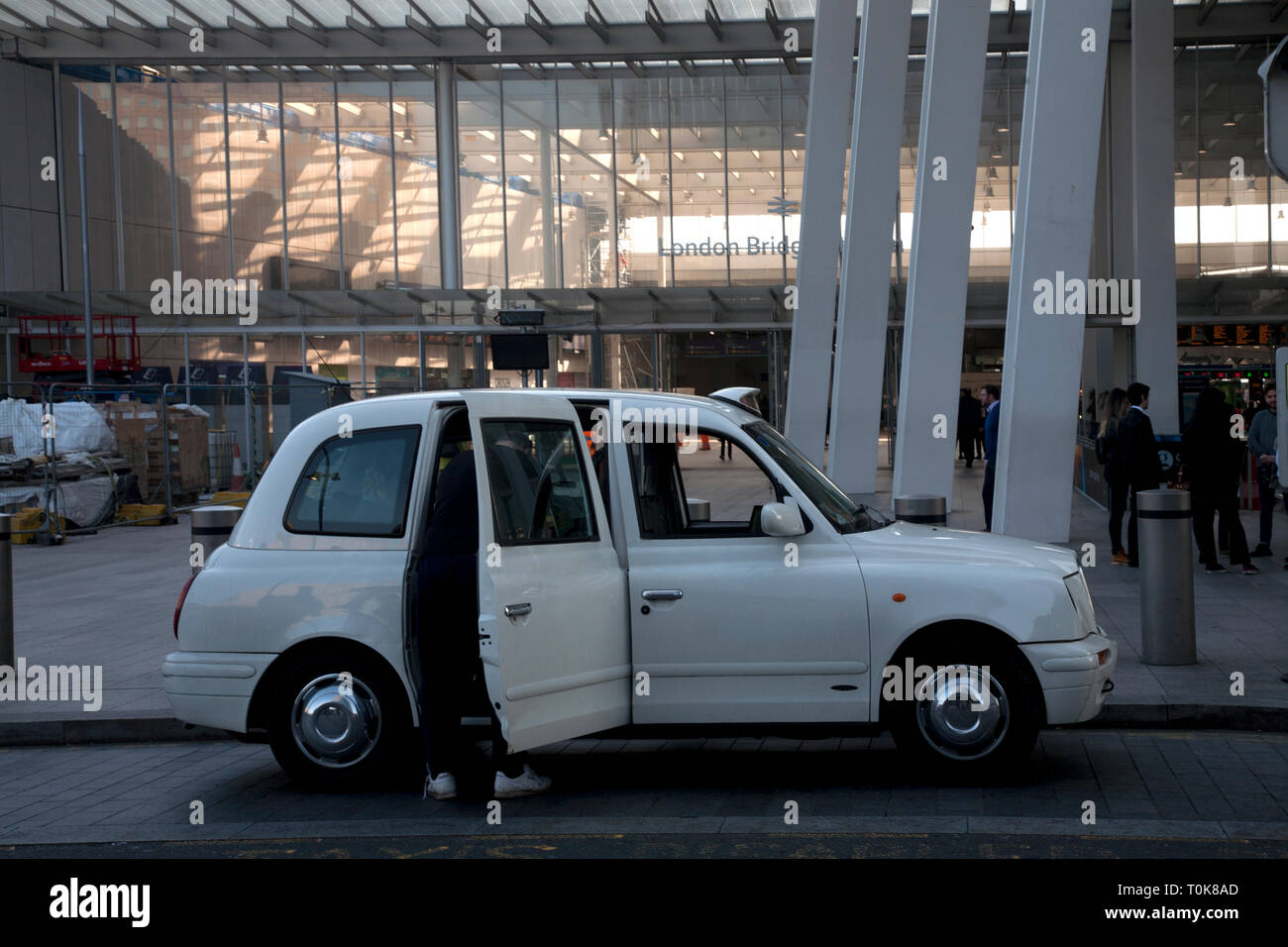 white taxi london bridge station forecourt and entrance london england ...