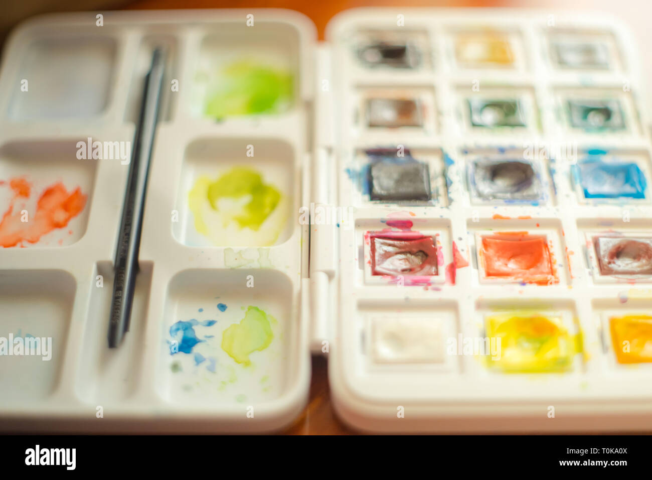 watercolor set in white box with brush closeup Stock Photo - Alamy