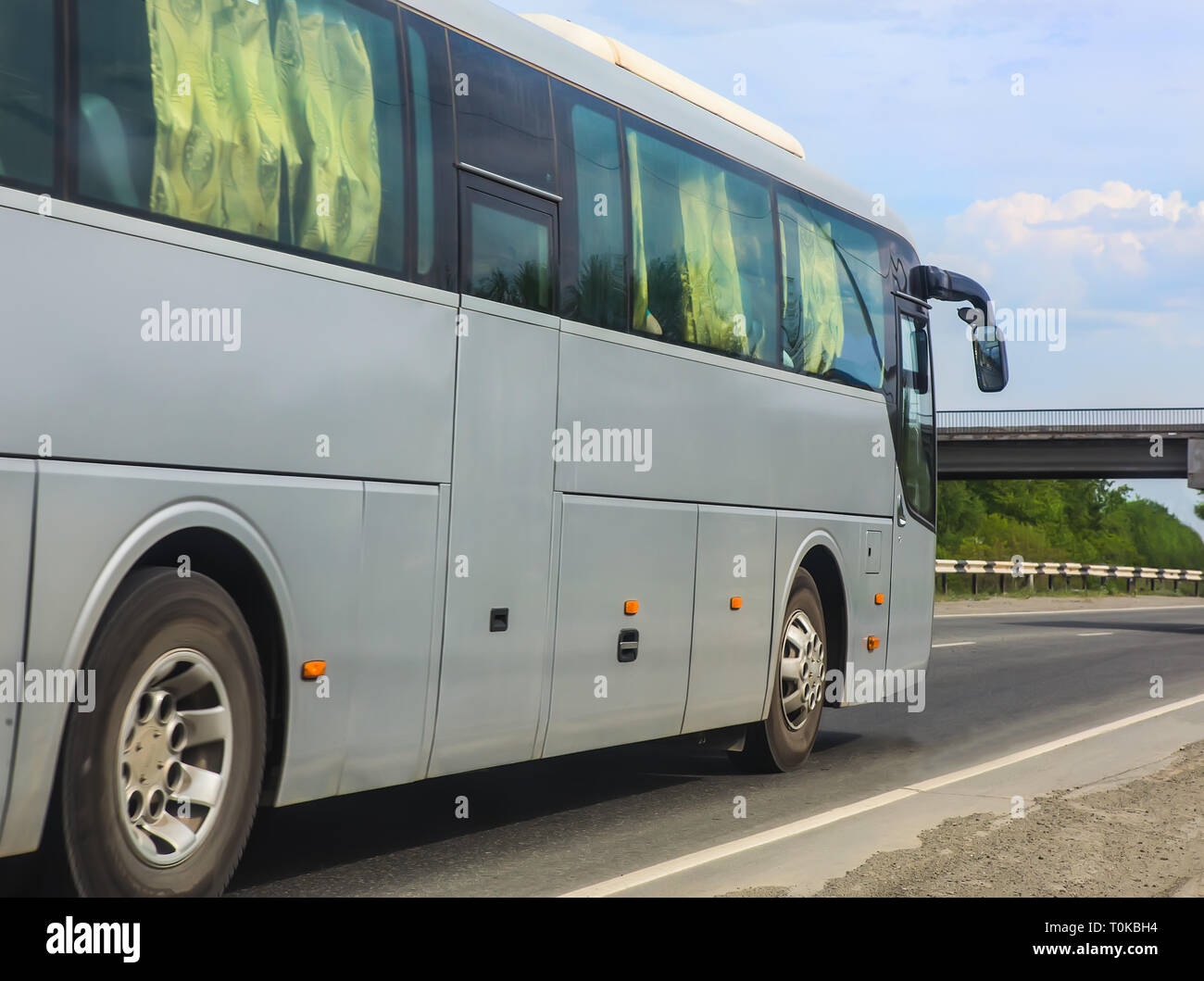 tourist bus goes on highway in country Stock Photo - Alamy