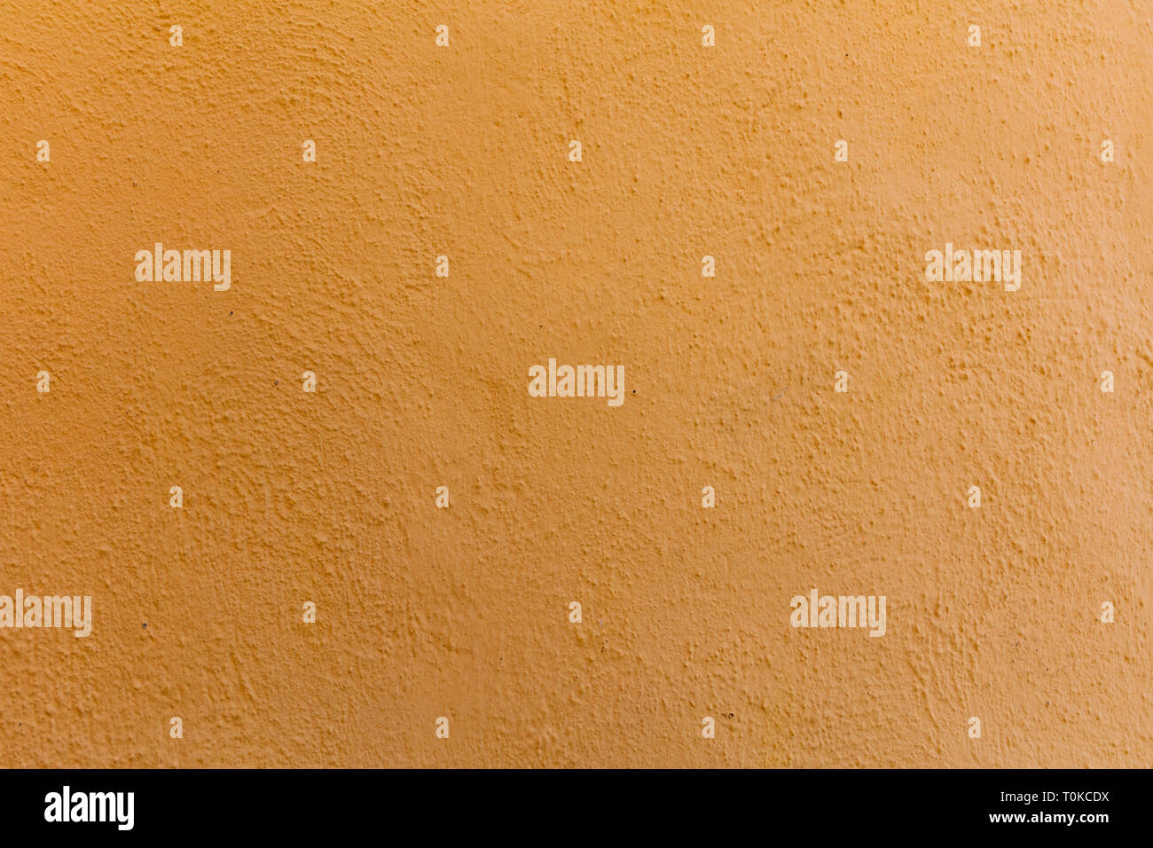 Orange color painted wall, building facade. Painted wall texture ...