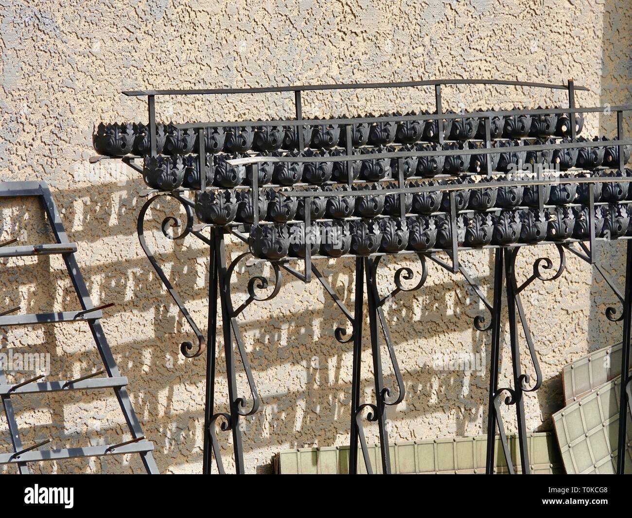 Black metal votive candle rack hi-res stock photography and images - Alamy