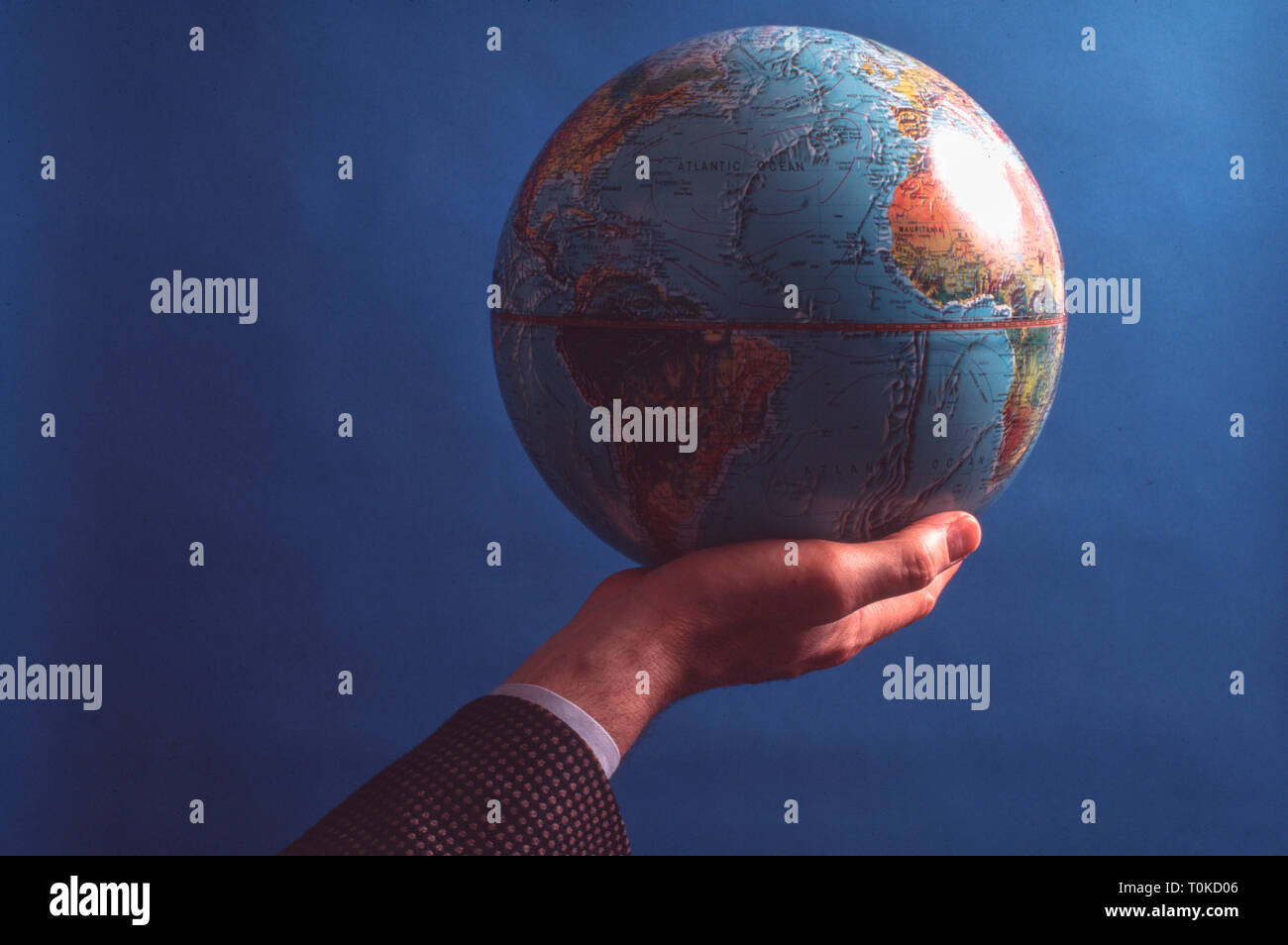 man holding earth globe Stock Photo - Alamy