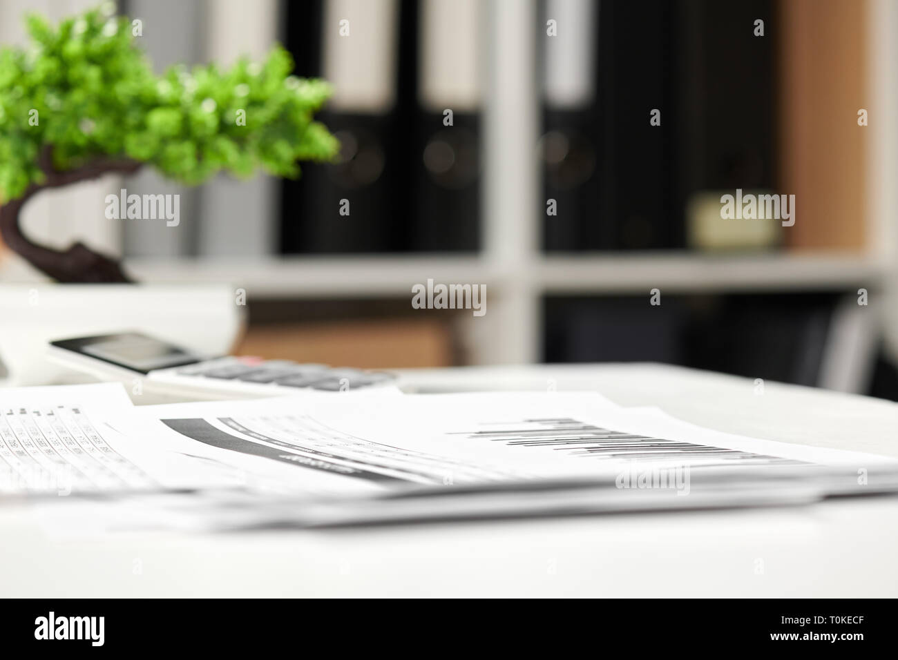Office interior, closeup table with reports. Business financial ...