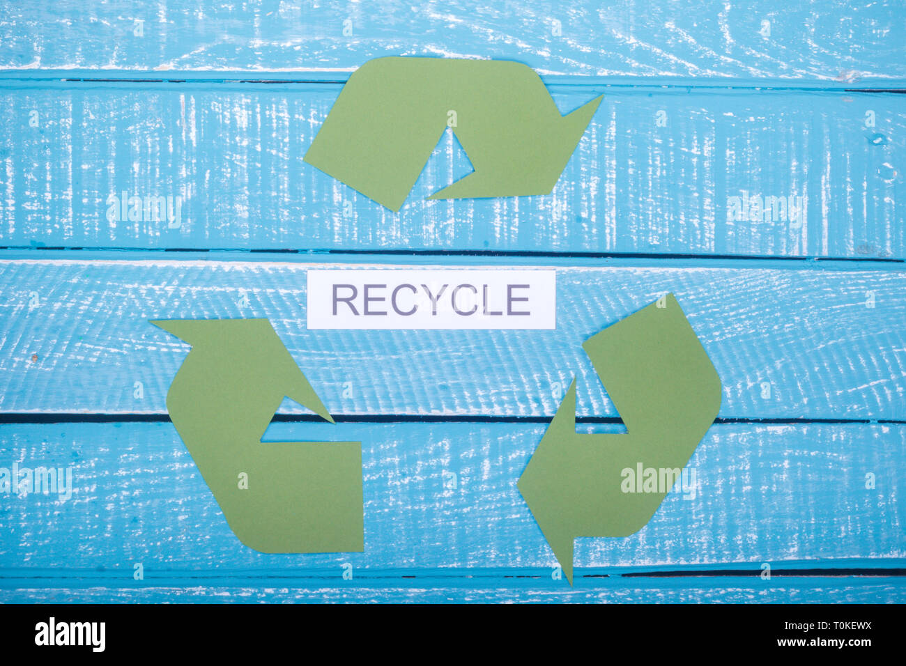 Recycle concept showing the green recycle logo with recycle on a blue ...