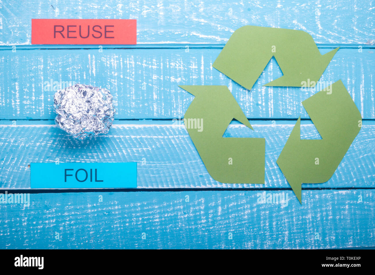 Recycle concept showing foil & reuse with the green recycle logo on a ...