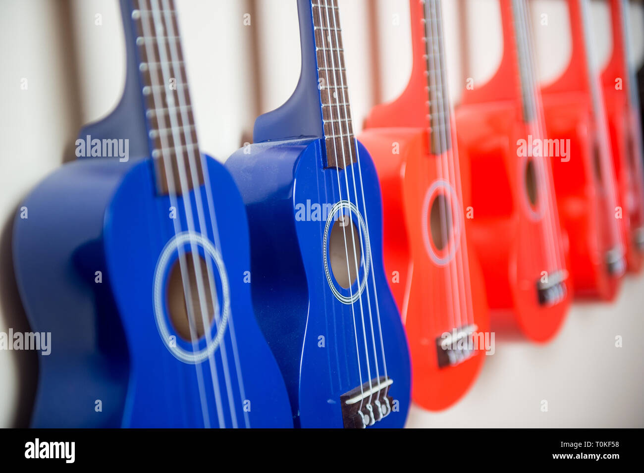 Red and Blue ukulele guitars Stock Photo - Alamy