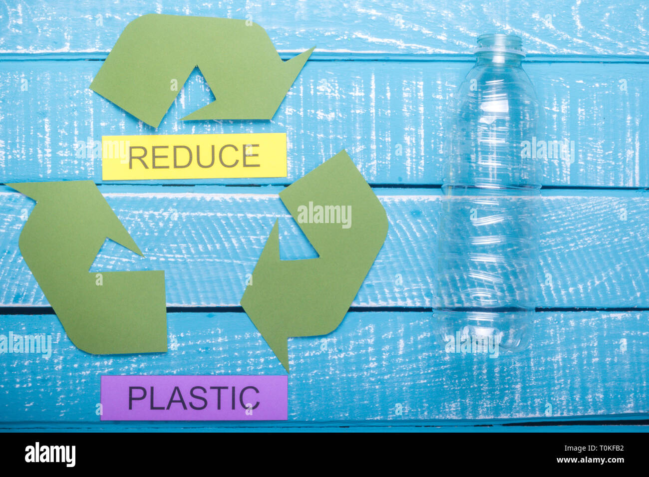 Recycle concept showing the green recycle logo with plastic & reduce on ...