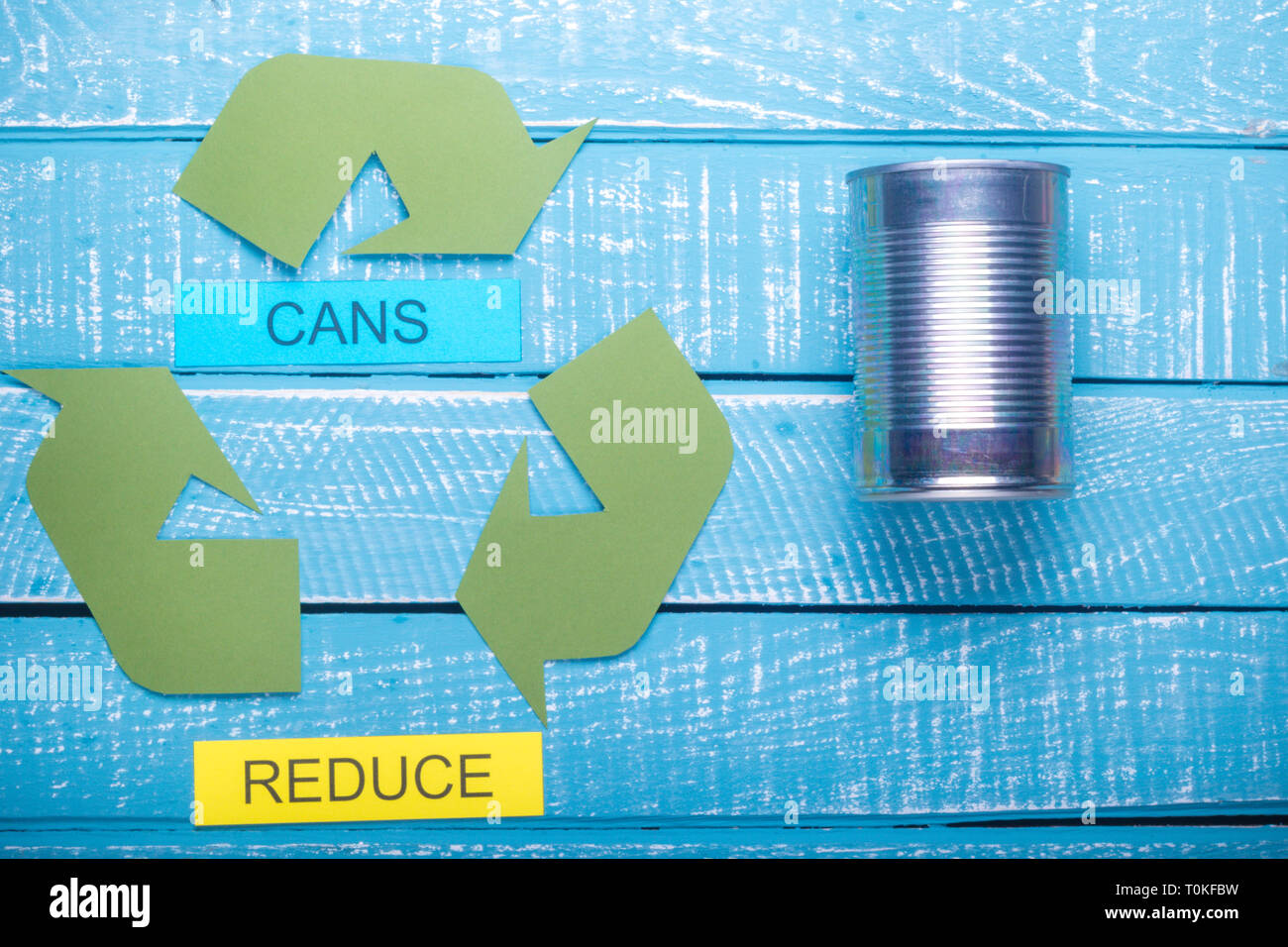 Recycle concept showing the green recycle logo with cans & reduce on a ...