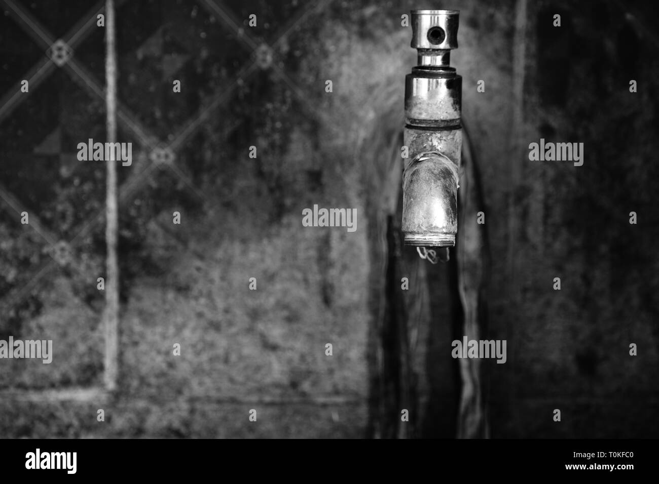Rusty old water tap in black and white view Stock Photo - Alamy