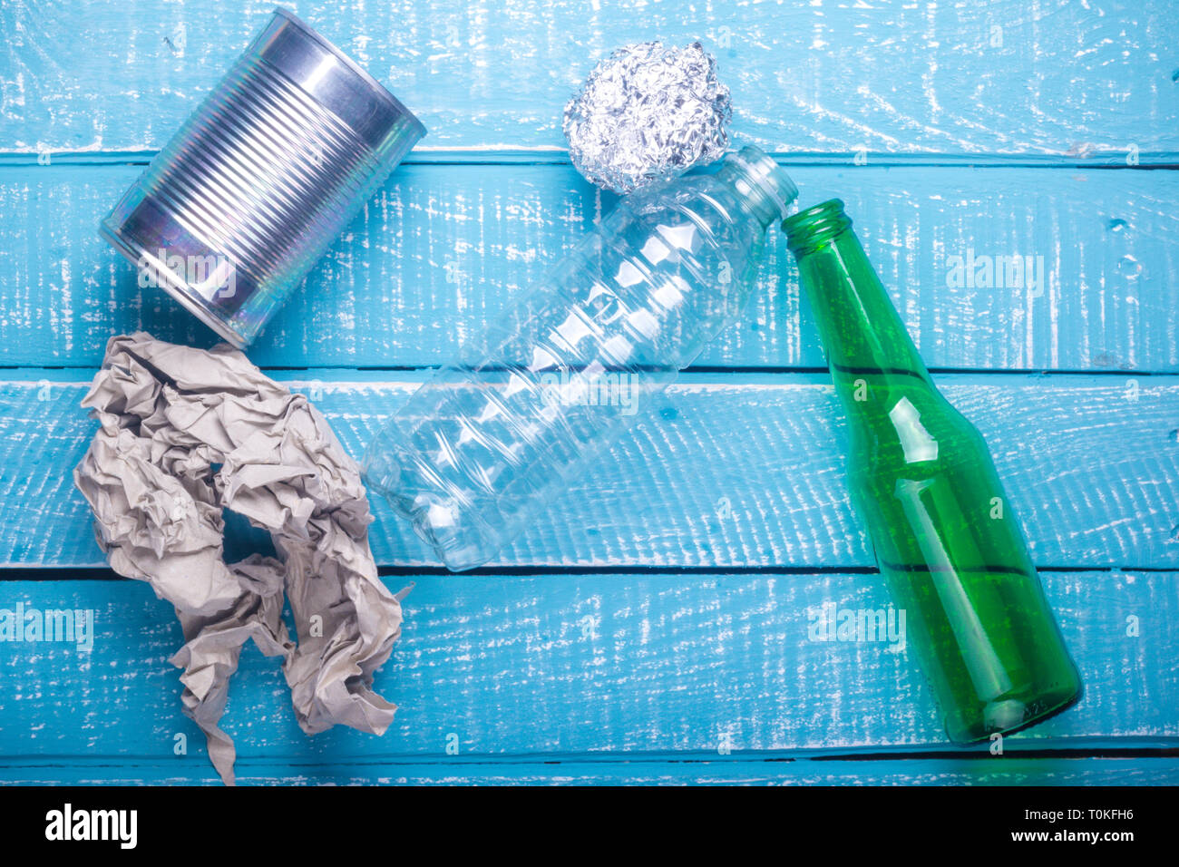 Recycle concept showing waste products of paper, glass, plastic, foil ...