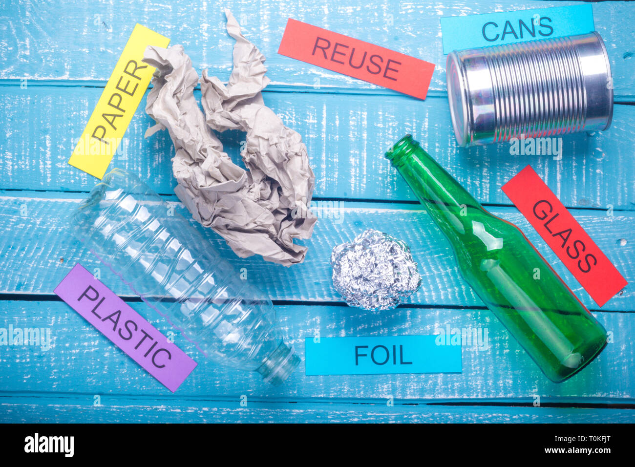 Recycle concept showing waste products of paper, glass, plastic, foil ...