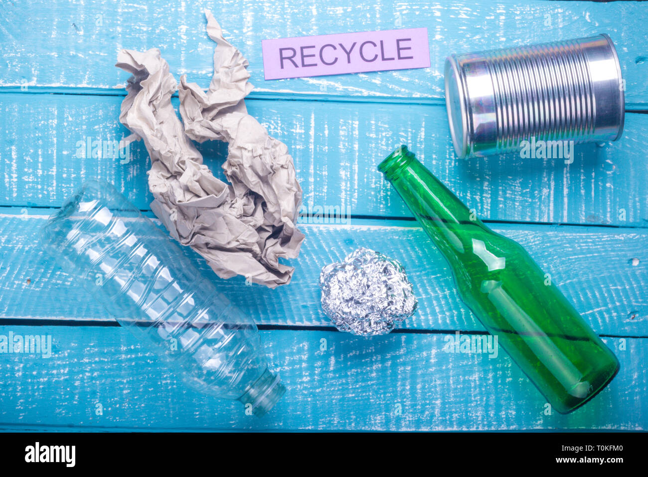 Recycle concept showing waste products of paper, glass, plastic, foil ...