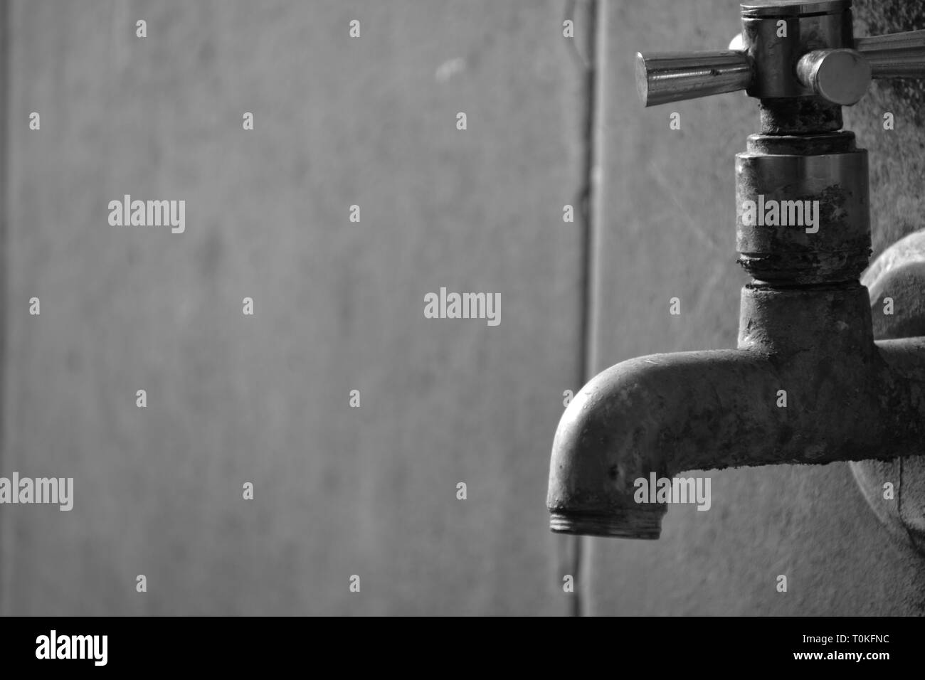 Rusty old water tap in black and white view Stock Photo - Alamy