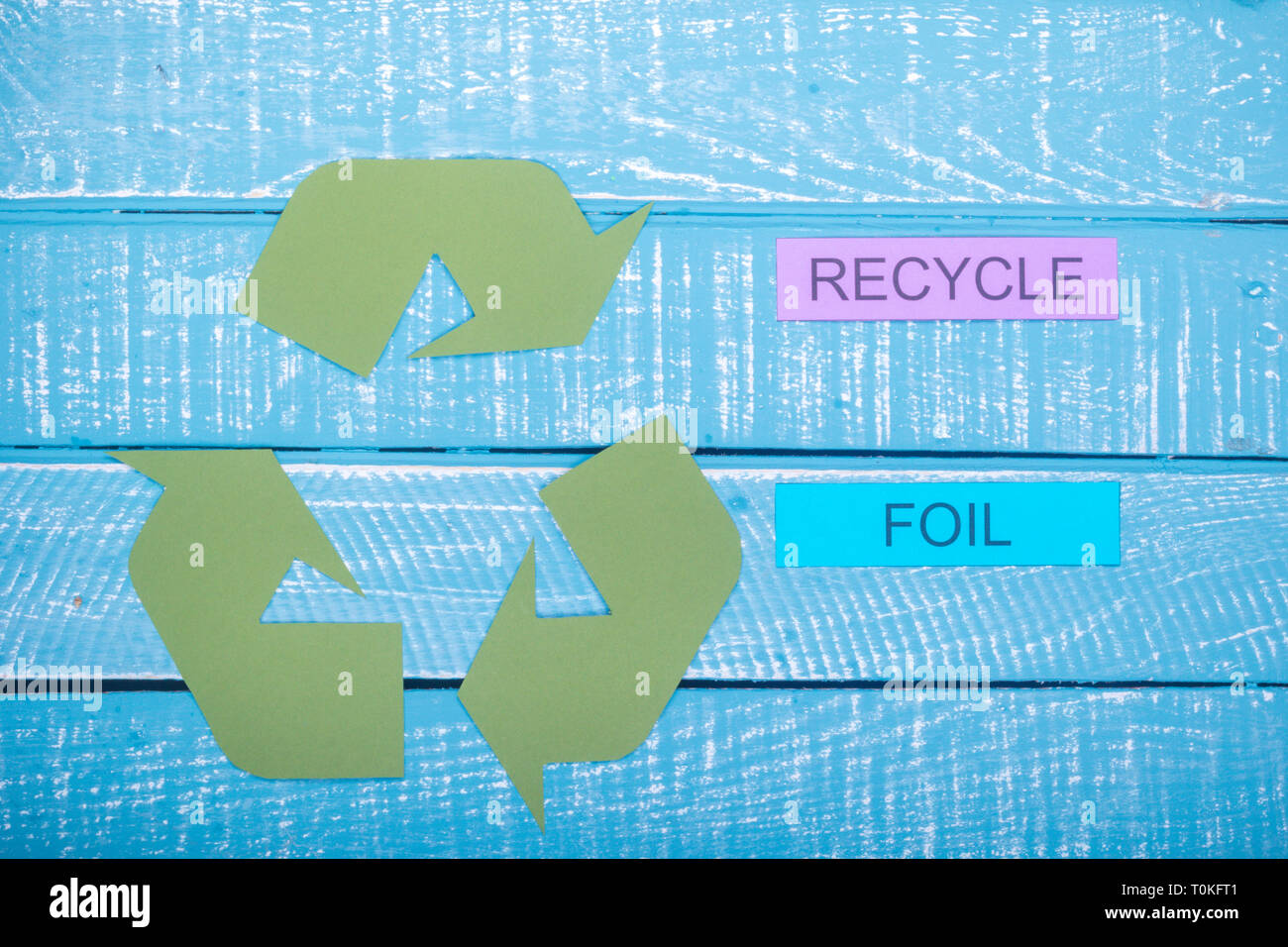 Recycle concept showing the green recycle logo with recycle foil on a ...