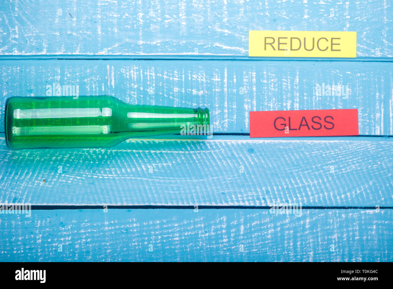 Recycle concept showing reduce glass on a blue weathered background ...