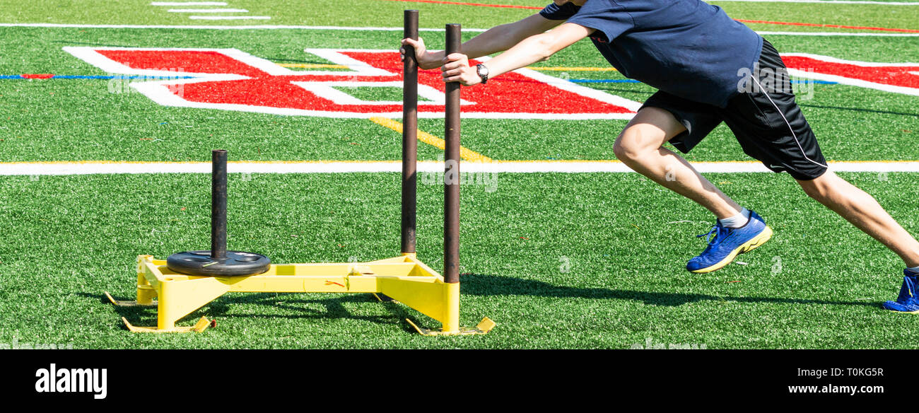 Boy pushing sled hi-res stock photography and images - Alamy