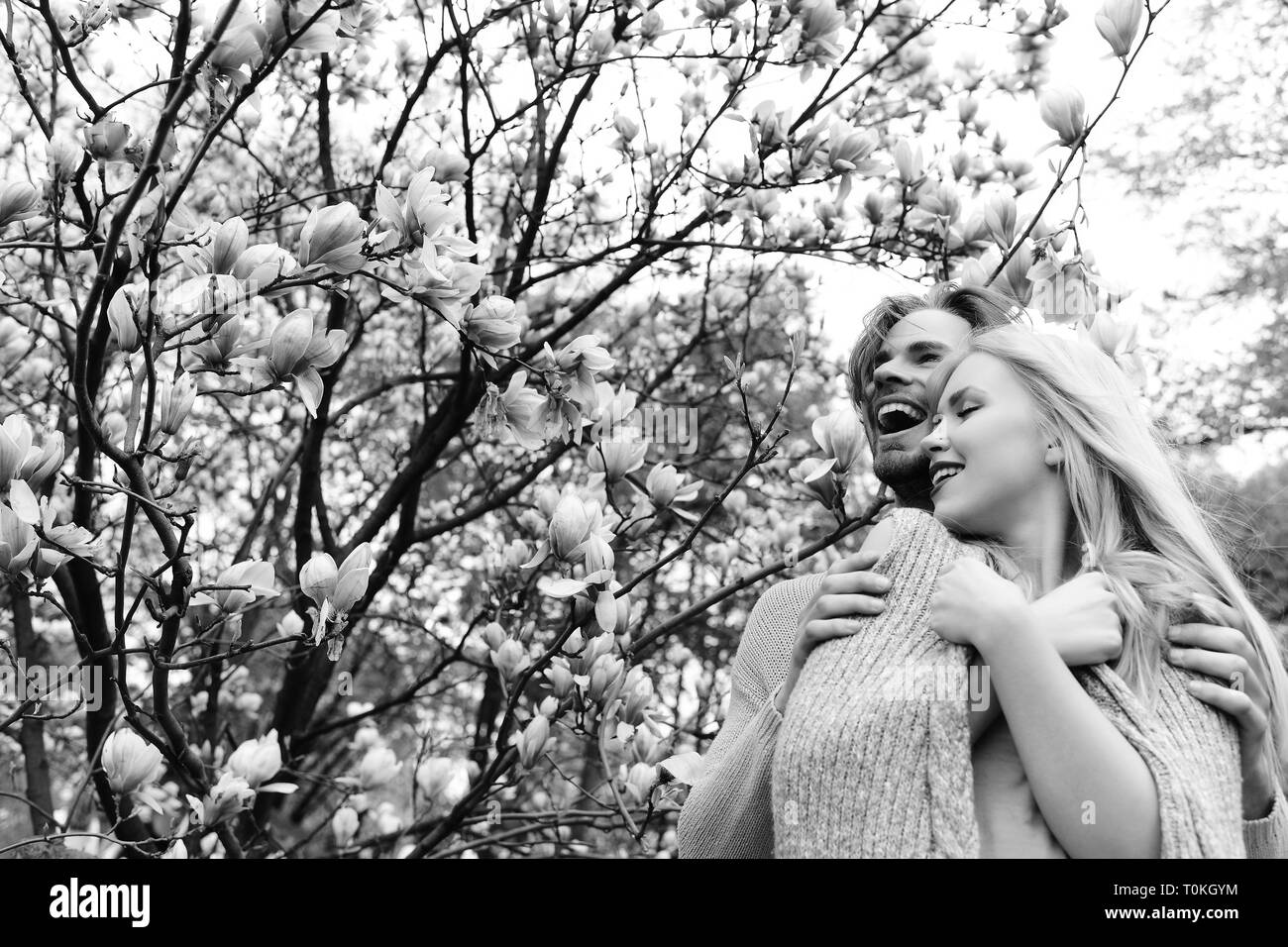 romantic couple in love in spring garden at blooming magnolia Stock ...