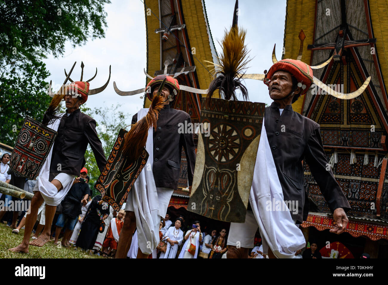 Residents wearing traditional clothes are seen performing rituals ...
