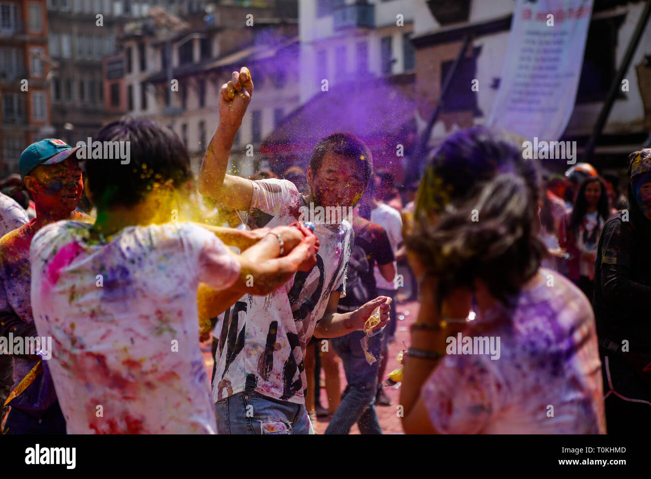 People are seen throwing colours to each during the festival. Holi ...