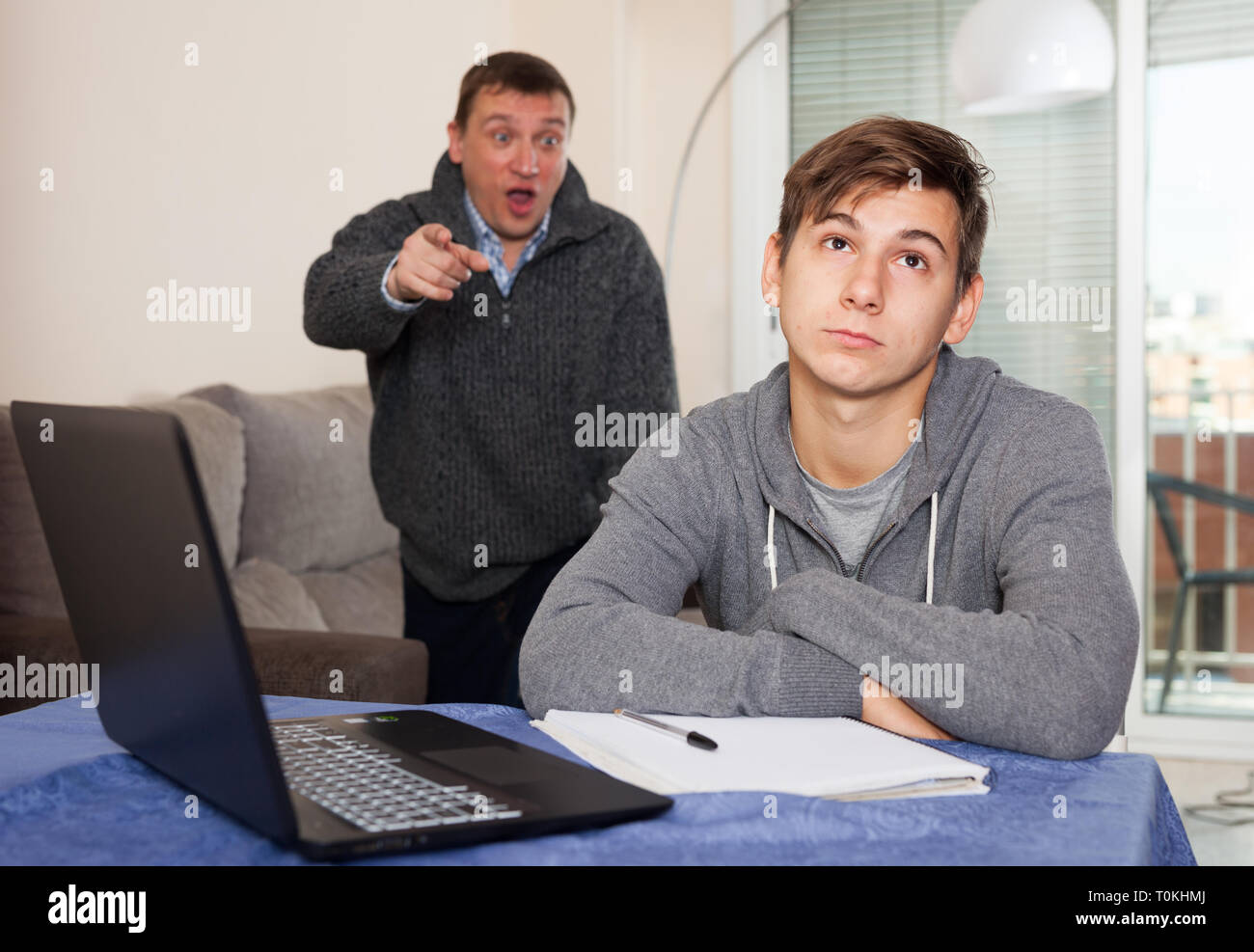 Father unhappy with how teenage son learns Stock Photo - Alamy