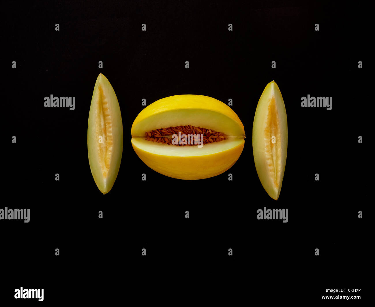 Yellow Melon Fruit isolated in black background viewed from above ...