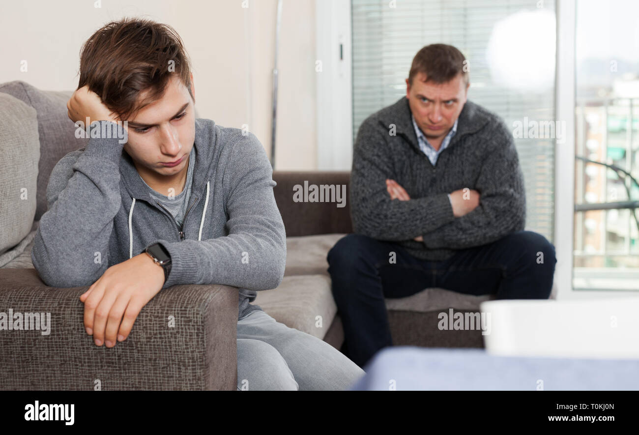 Teenager son quarreled with her father Stock Photo - Alamy