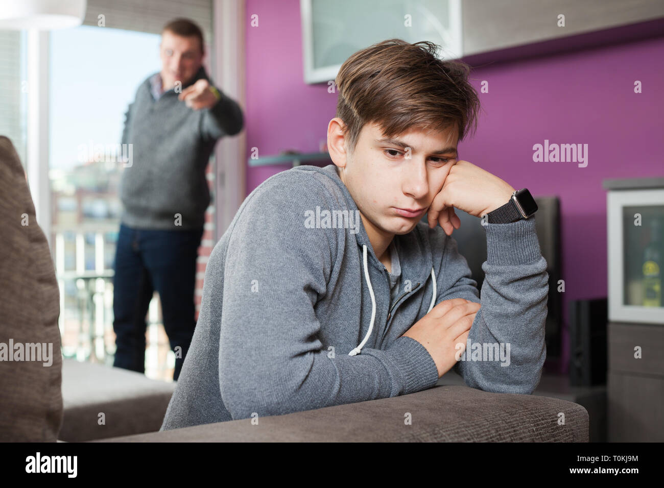 Angry father screaming at offender son Stock Photo - Alamy