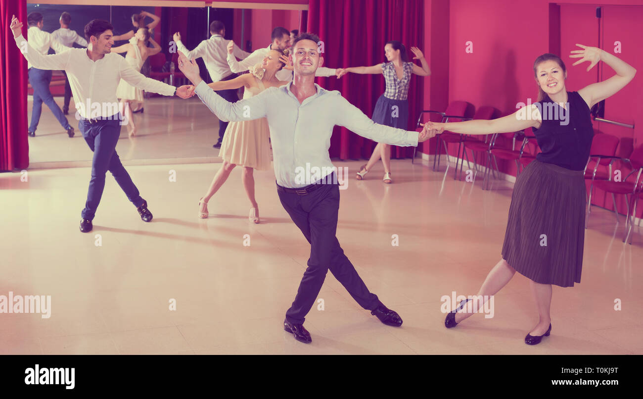 People dancing lindy hop in pairs in dance hall Stock Photo - Alamy