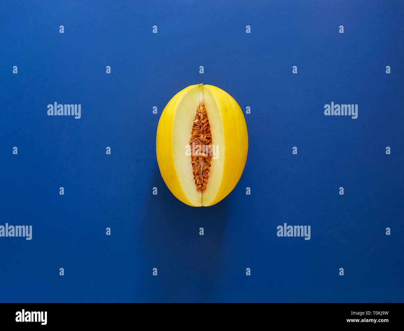 Yellow Melon Fruit isolated in blue background viewed from above ...