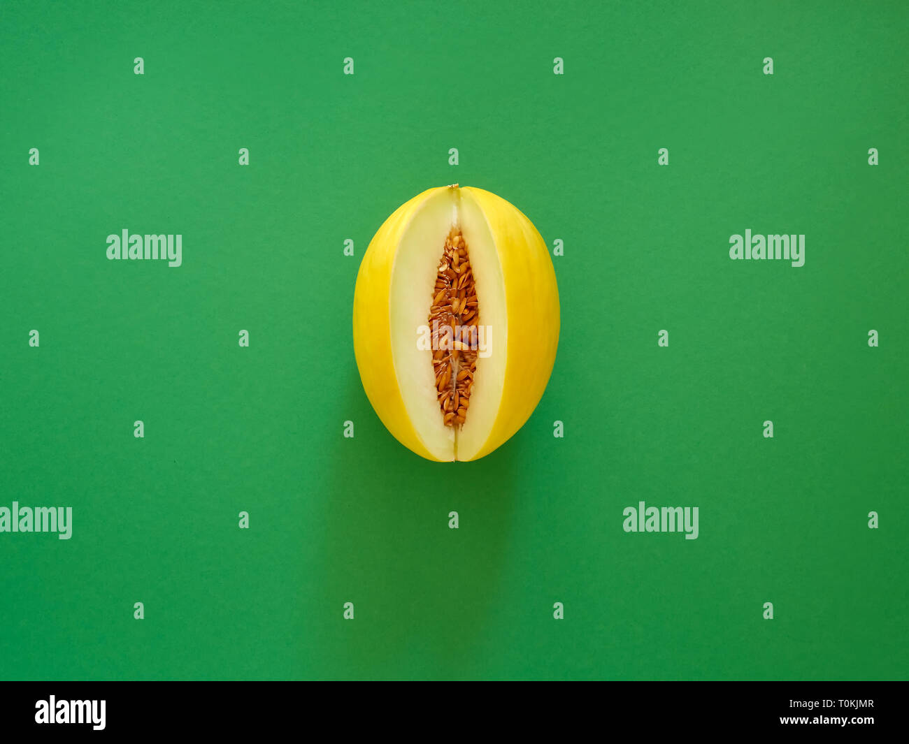 Yellow Melon Fruit isolated in green background viewed from above ...
