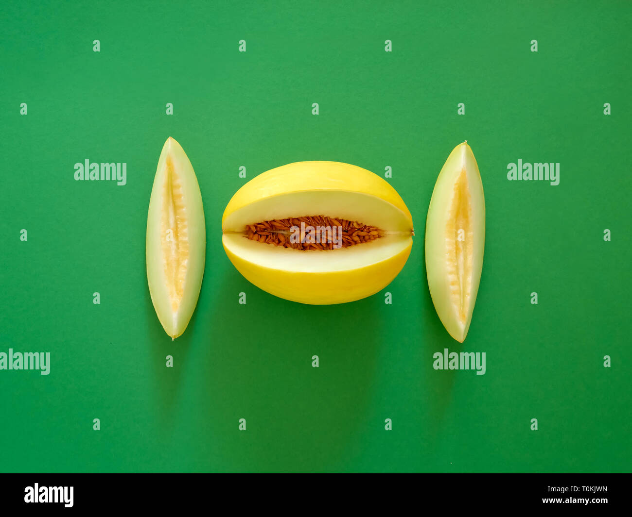 Yellow Melon Fruit isolated in green background viewed from above ...
